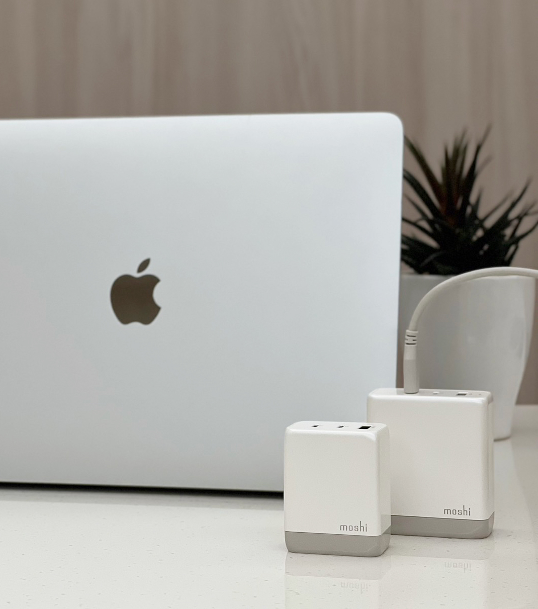 Wood table with porcelain mug, leather journal, brass pen, leather key ...